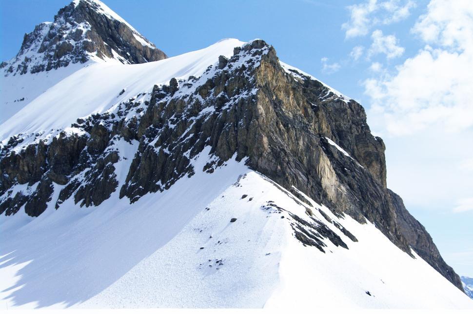 Free Stock Photo of Majestic Snow-Covered Mountain Under Blue Sky ...