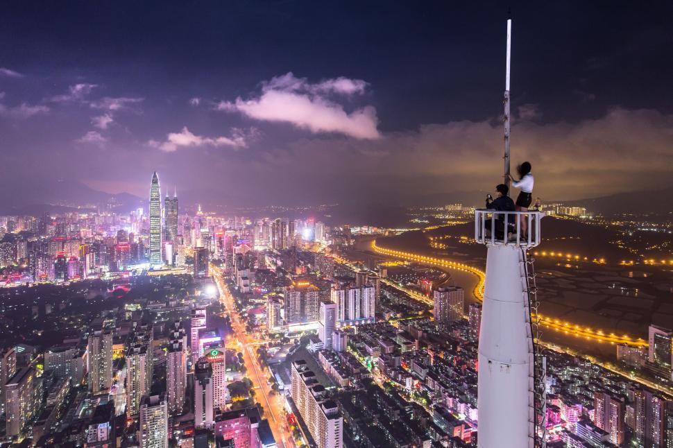 Free Stock Photo of Couple on tower on capture night lights of city ...