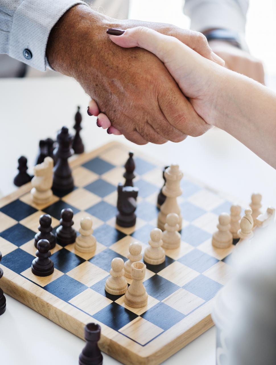 Free Stock Photo of Close up of a handshake over a chessboard after ...