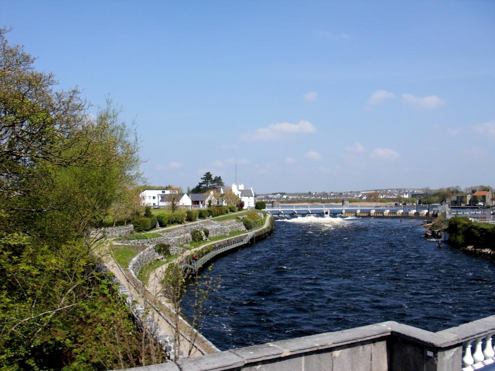Free Stock Photo of River Running Through City Next to Bridge ...
