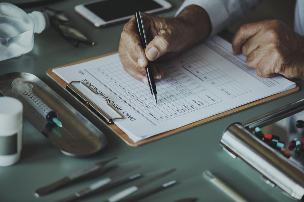 Free Stock Photo of Close up of a doctor s hand checking schedule ...