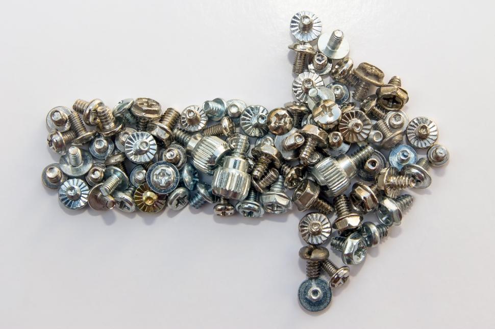 Free Stock Photo of A collection of bolts forms a direction screw ...