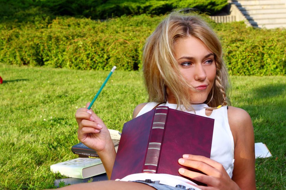Free Stock Photo of student girl laying in the grass thinking ...