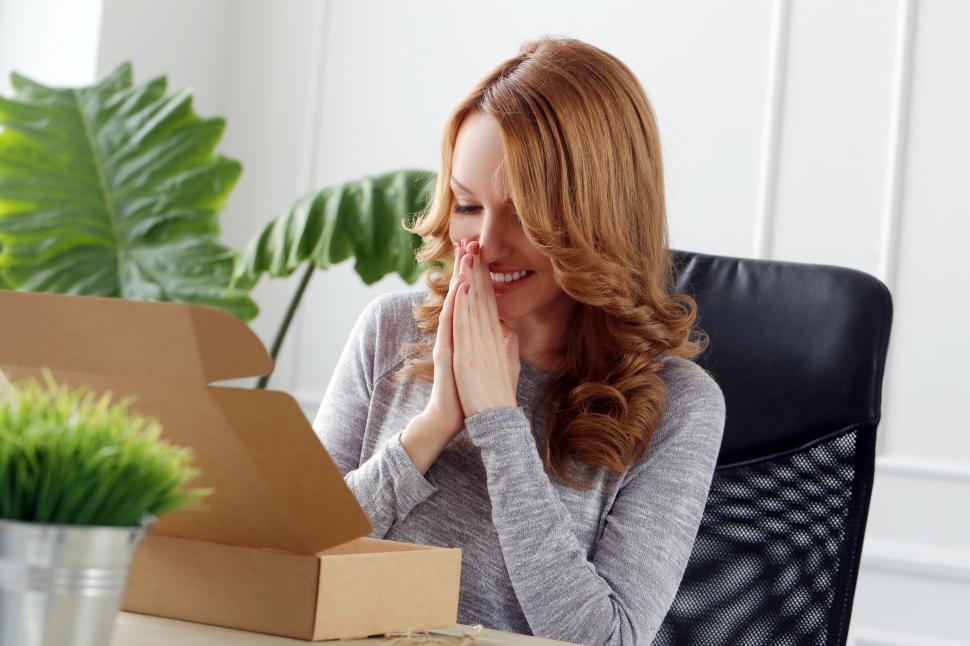 Free Stock Photo of Lifestyle. Woman delighted after opening a box ...