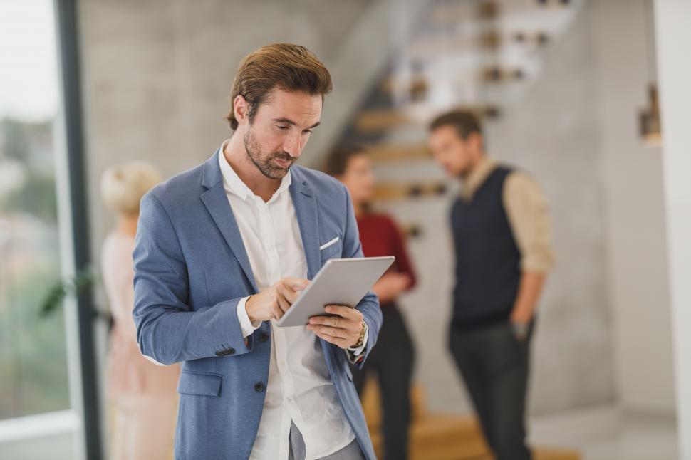 Free Stock Photo of Male executive with tablet, standing in the office ...
