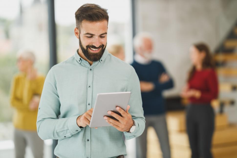 Free Stock Photo of Male executive with tablet in office | Download ...