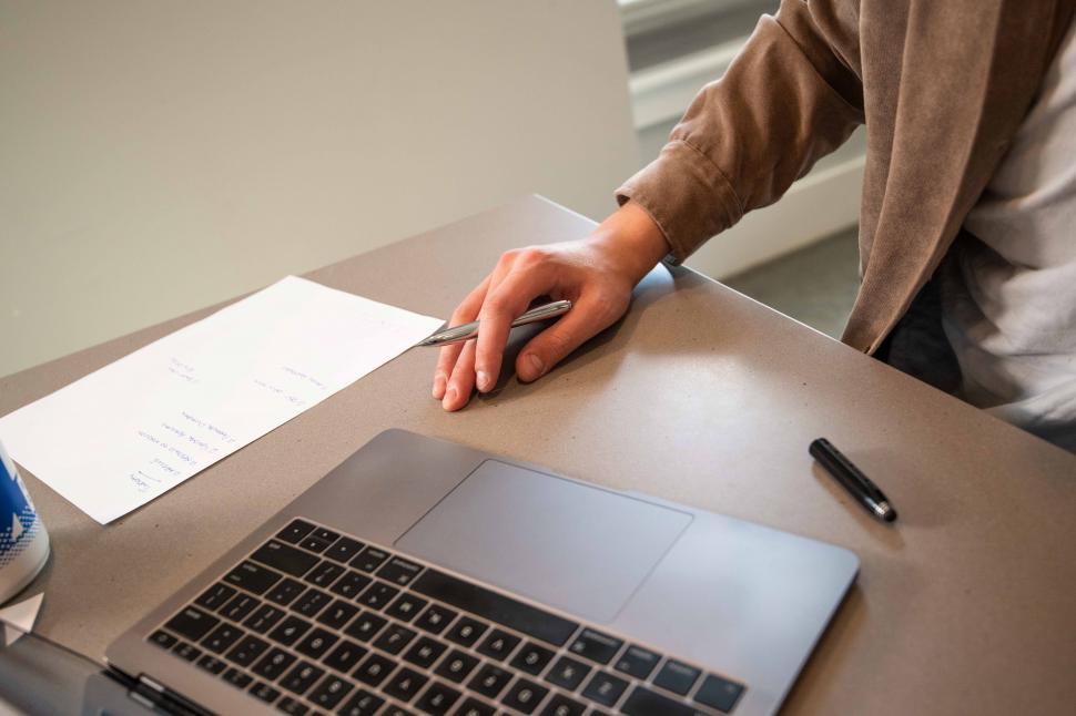 Free Stock Photo of Laptop and paper with hand on table | Download Free ...