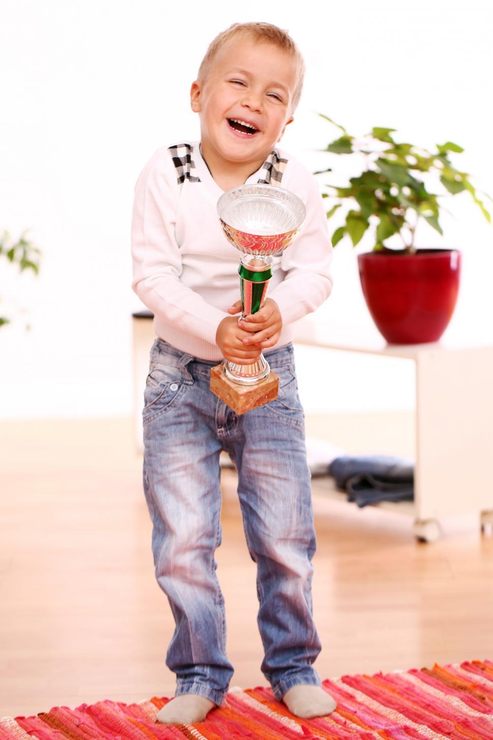 Free Stock Photo of Kid is excited to win a trophy | Download Free ...