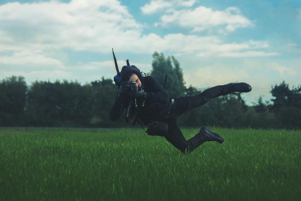 Free Stock Photo of Male photographer doing stunts in the greenfield ...