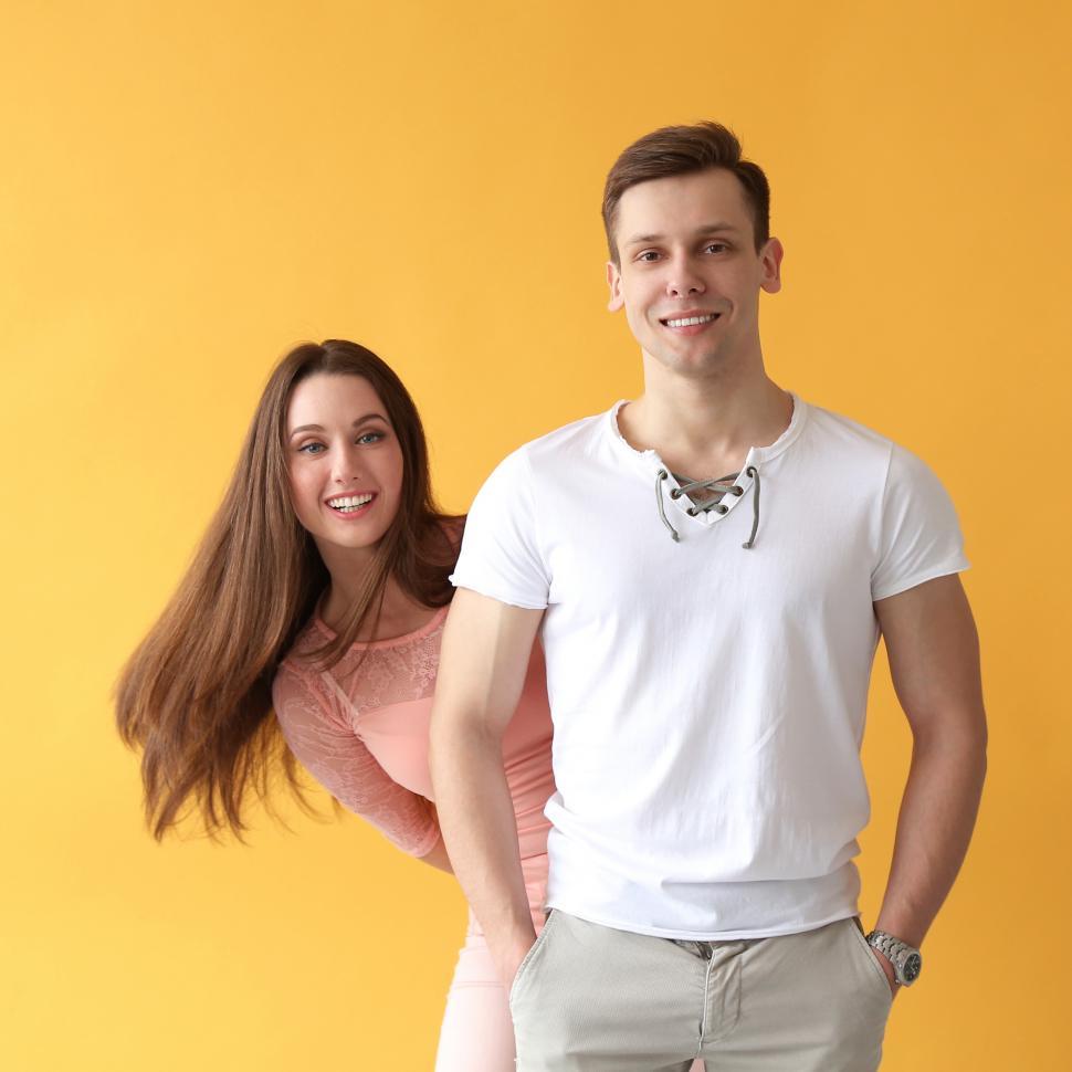 Free Stock Photo of Playful young couple, yellow background | Download ...