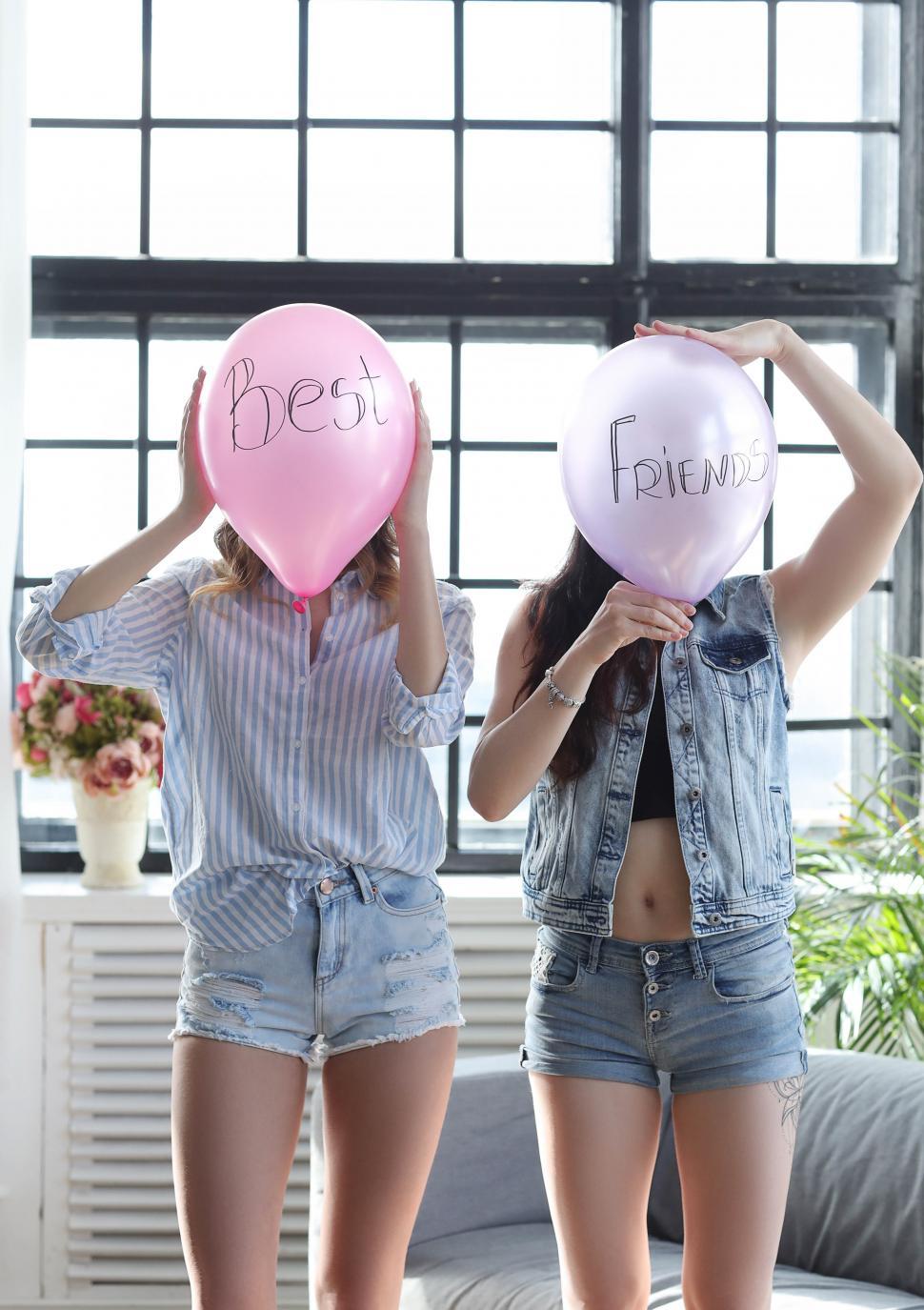 Free Stock Photo of Best friends with balloons over their faces ...
