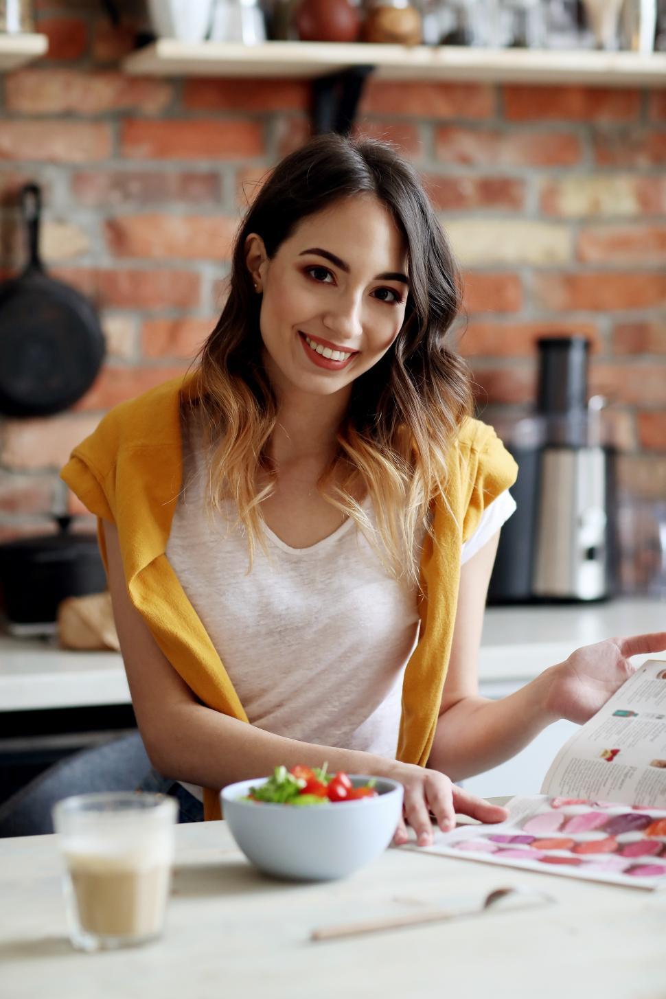 Free Stock Photo of Woman reading and eating at a counter | Download ...