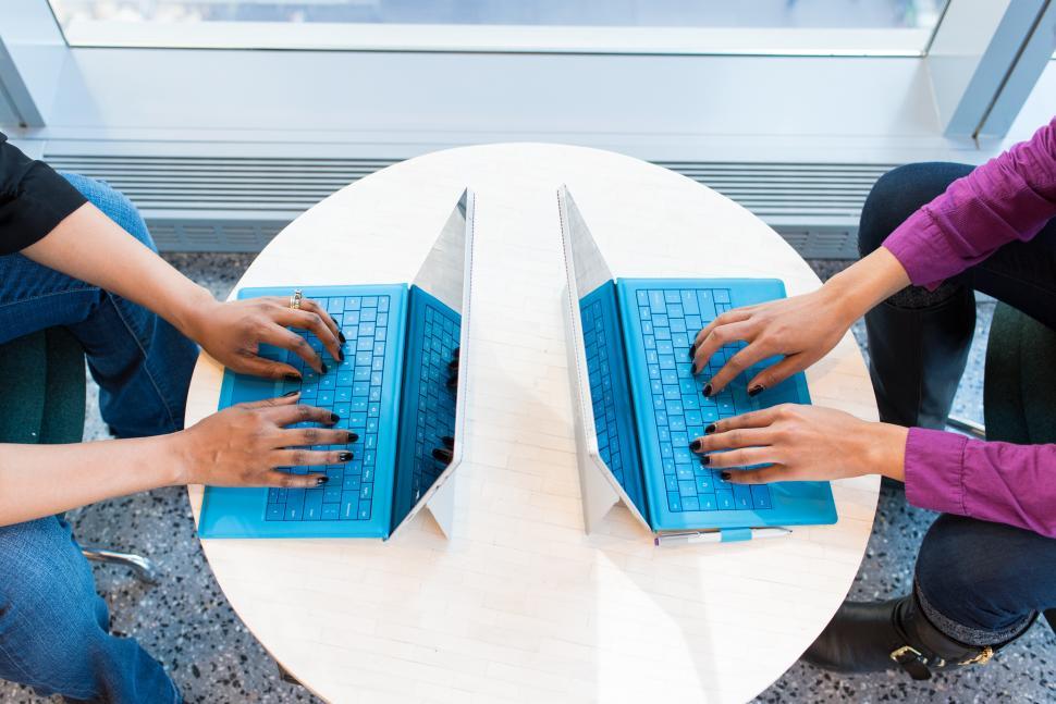 Free Stock Photo of Female co-workers hands on blue laptops | Download ...