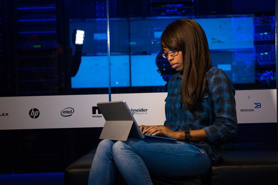Free Stock Photo of Woman engineer with laptop in data center ...
