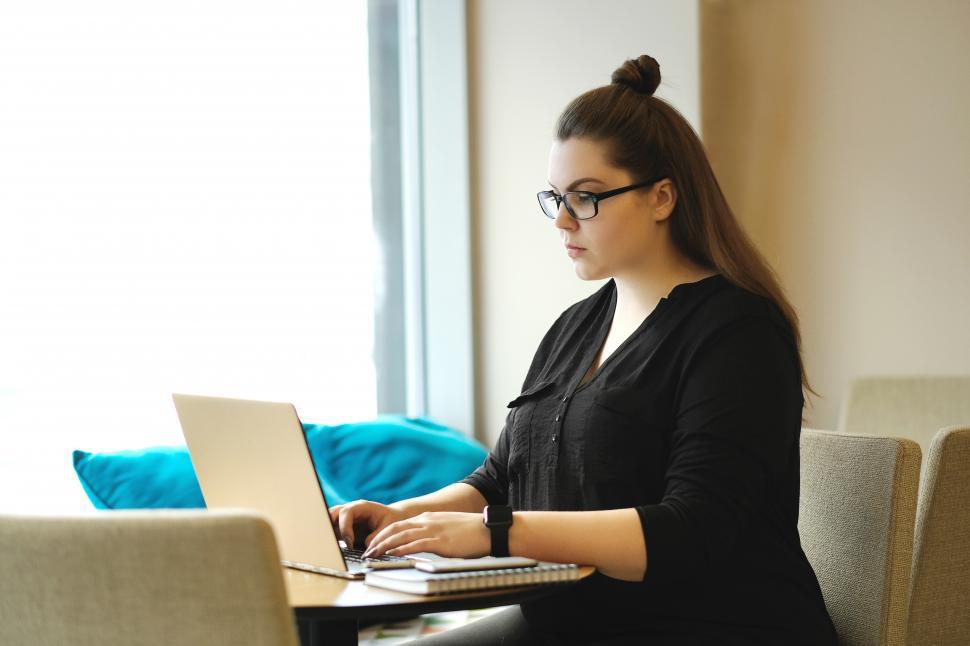 Free Stock Photo of Young woman working at a computer | Download Free ...