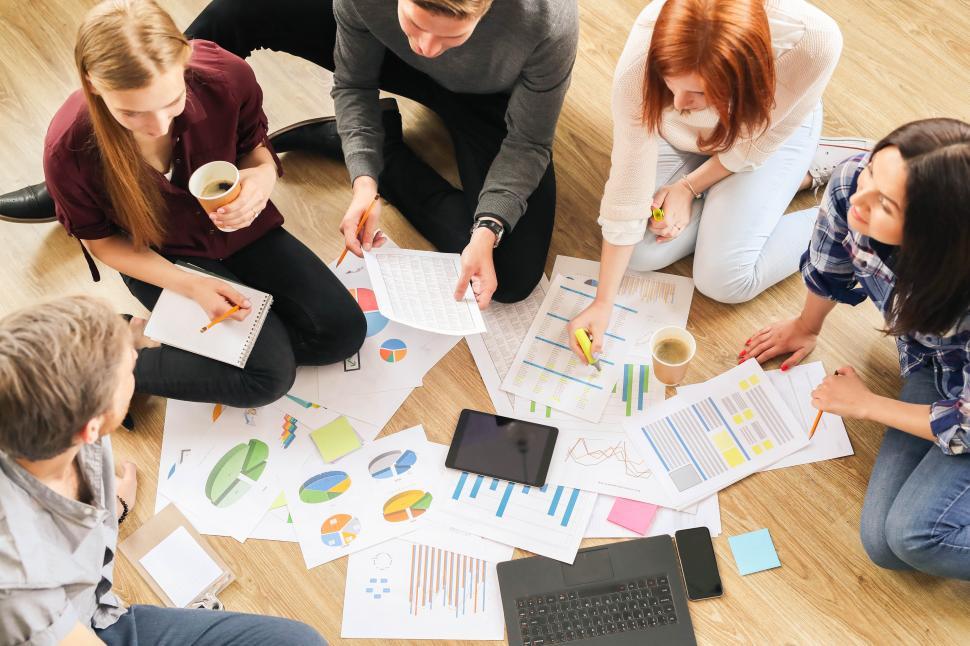Free Stock Photo of People in the office sitting on the floor working ...