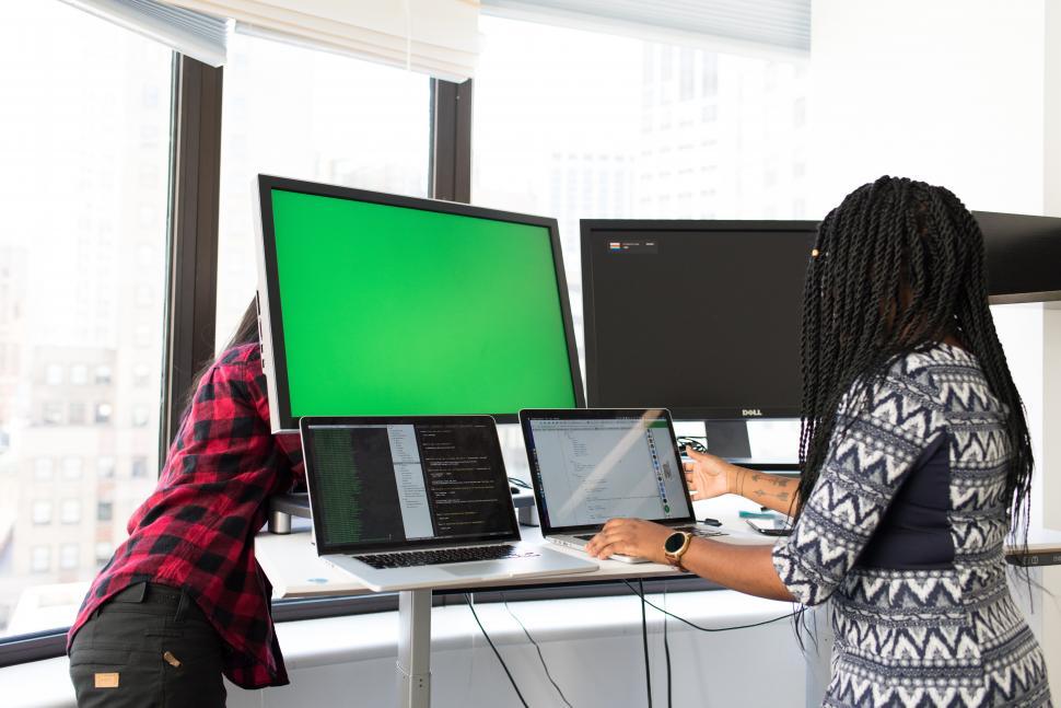 Free Stock Photo of Multi-ethnic female co-workers with computers ...