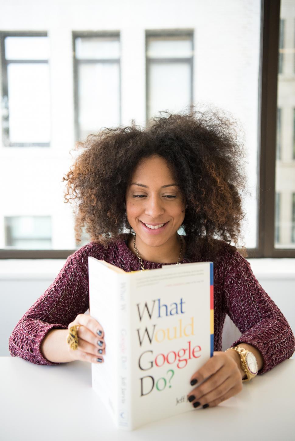 Free Stock Photo of Happy Female developer with book | Download Free ...