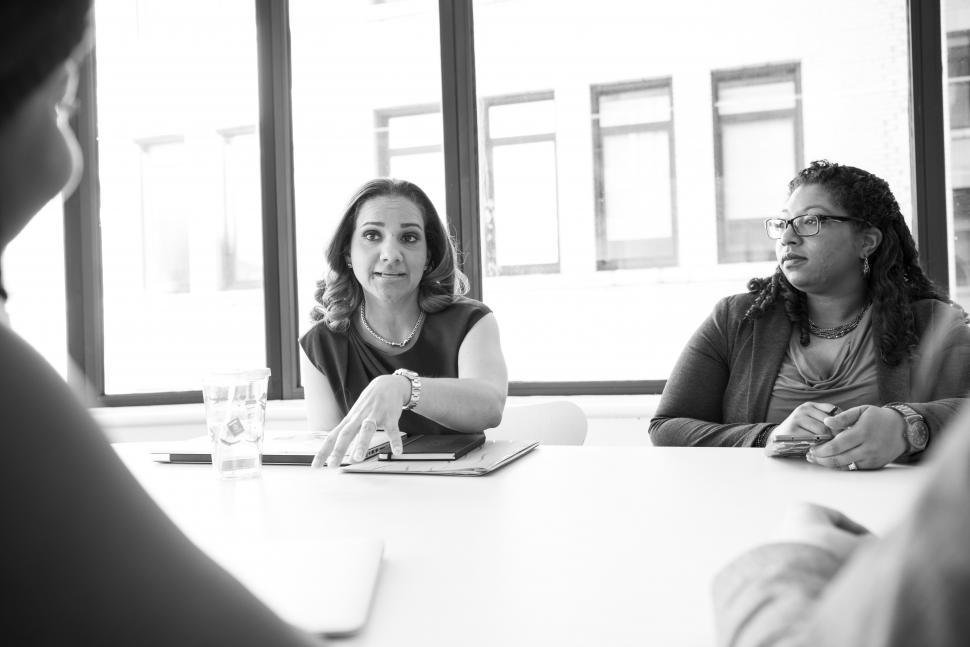 Free Stock Photo of Businesswomen discussing a plan with laptop in ...