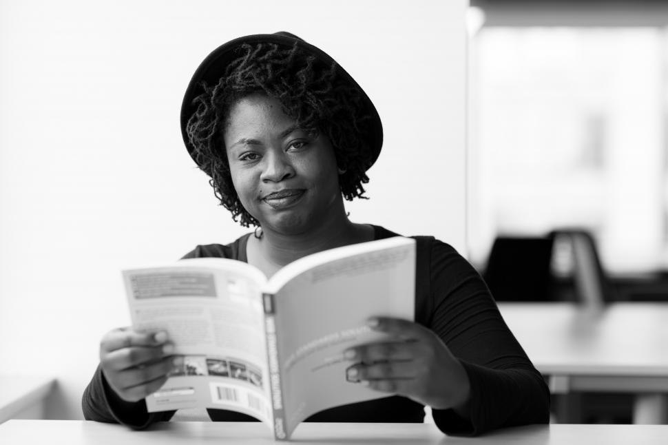 Free Stock Photo of Happy Female software developer with book - b&w ...