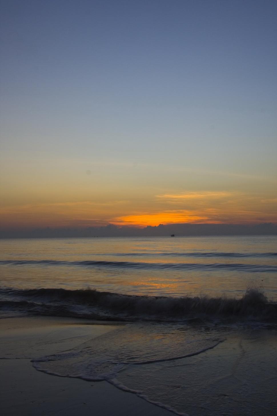 Free Stock Photo of Sun Setting Over Ocean on Beach | Download Free ...