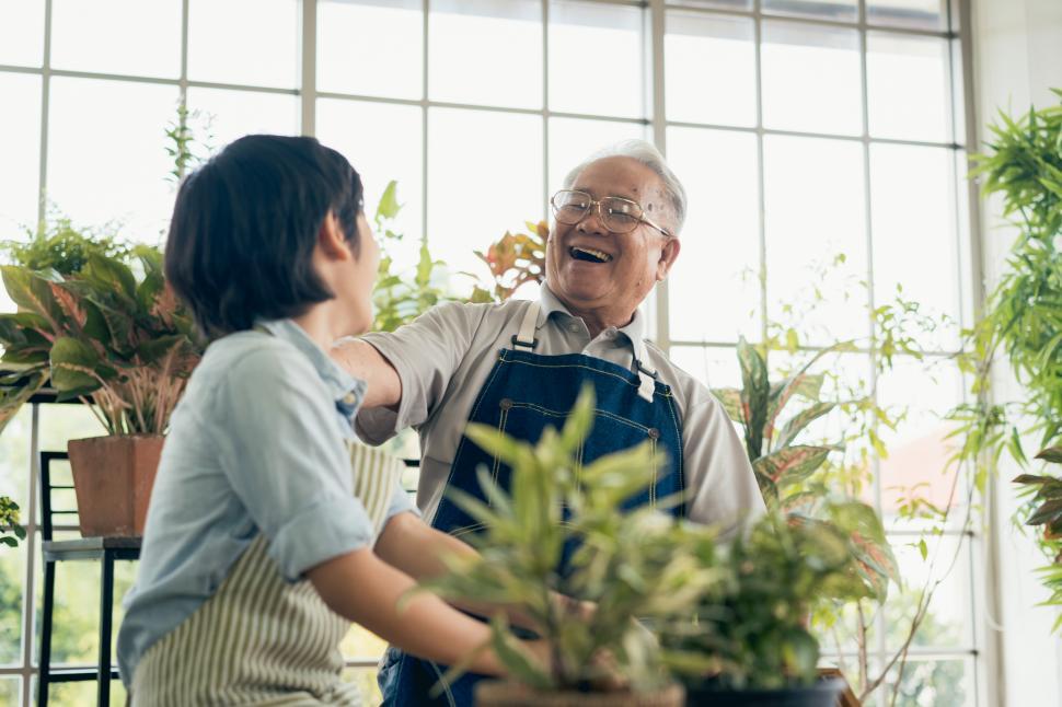 Free Stock Photo of Grandfather teaching grandson to care for plants ...