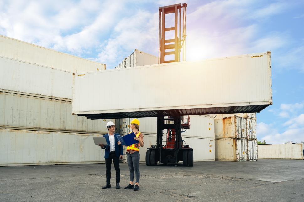 Free Stock Photo of two engineers hold a laptop, document for checking ...