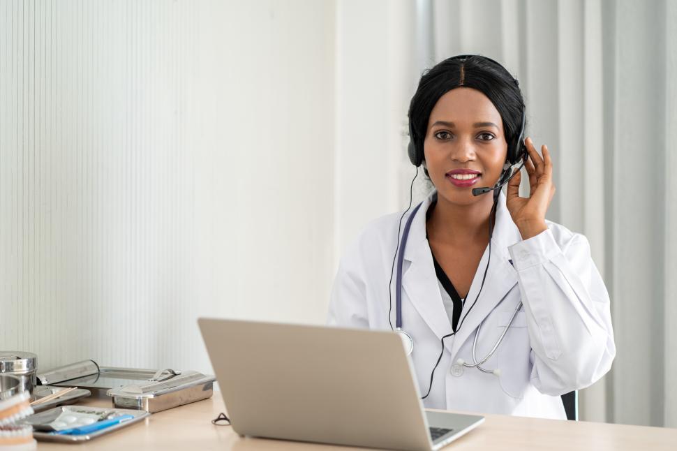 Free Stock Photo of Doctor in headset taking telehealth calls ...