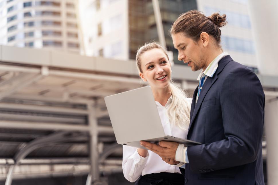 Free Stock Photo of Two business people discussing online data ...
