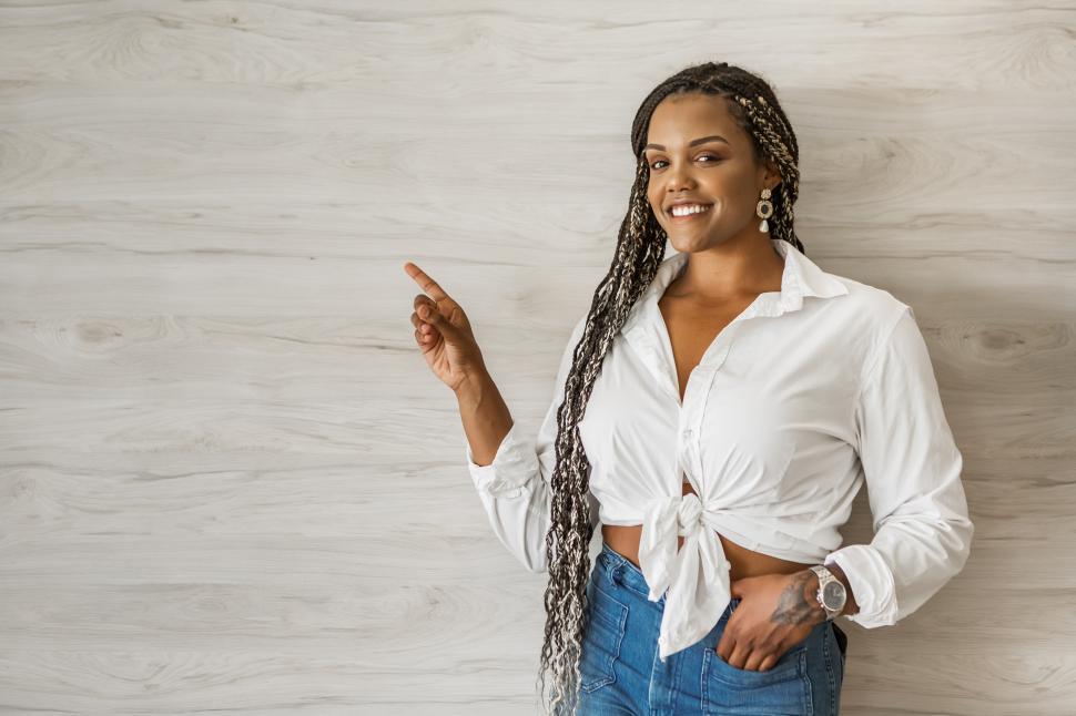 Free Stock Photo of Portrait of a smiling adult woman standing pointing ...