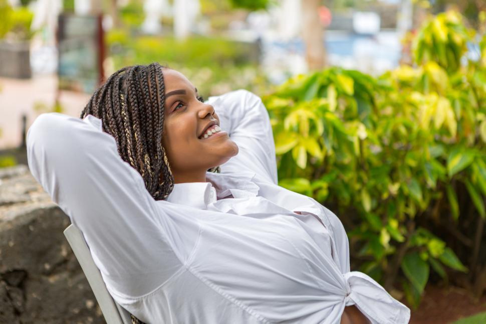 Free Stock Photo of Adult woman relaxing outside leaning back in a ...