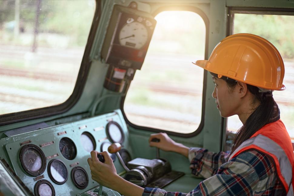 Free Stock Photo of The industrial technician is driving the machine ...