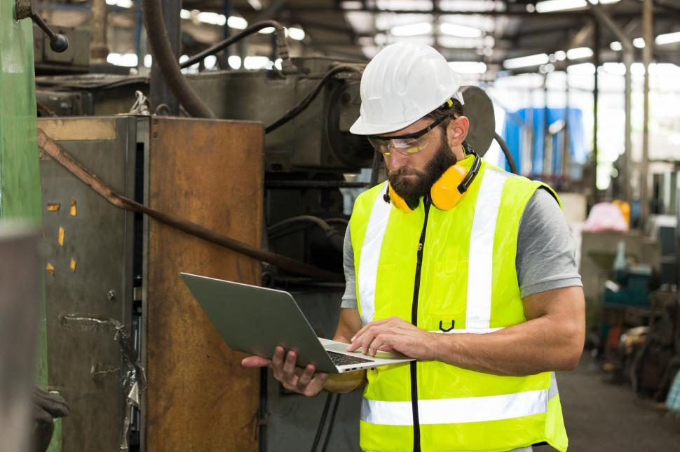 Free Stock Photo of Engineer monitoring the machines in the factory ...