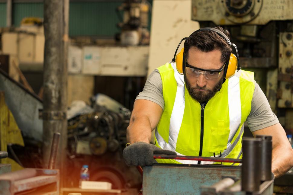 Free Stock Photo of Man working in a factory wearing safety gear ...
