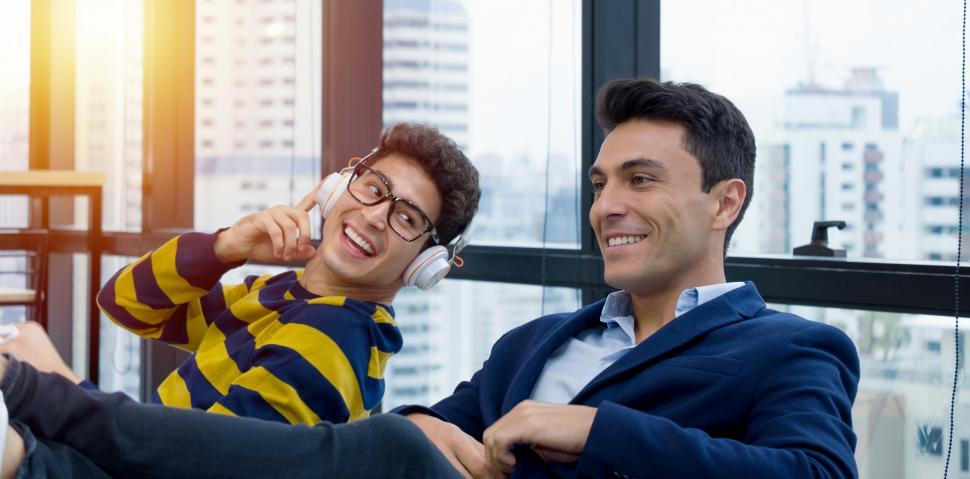 Free Stock Photo of Young colleagues chatting in a comfortable ...
