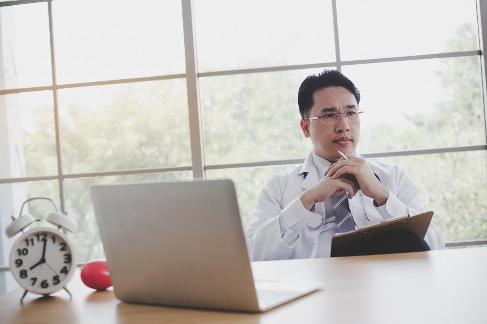 Free Stock Photo of Doctor is working at a desk in the morning ...