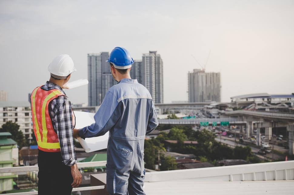 Free Stock Photo of Engineer are consulting to build tall building ...