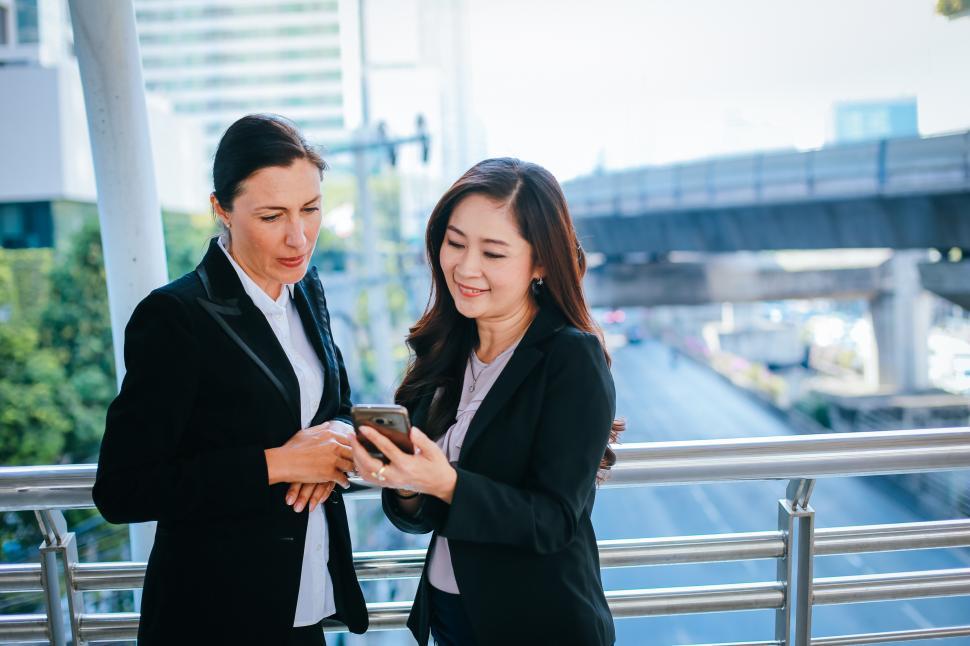 Free Stock Photo of Businesswoman looking at a smartphone | Download ...