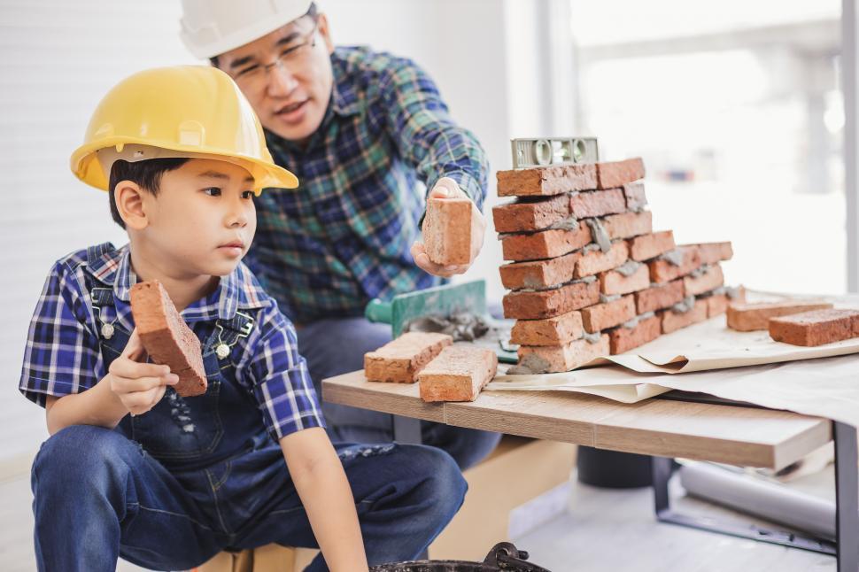 Free Stock Photo of Little engineer is helping his father lay the ...