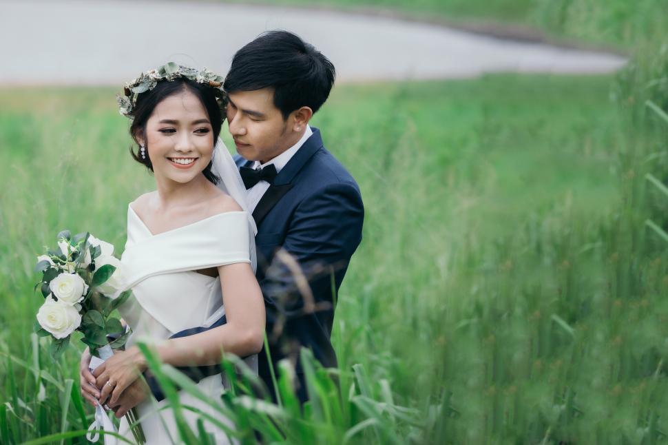 Free Stock Photo of Outdoor wedding photo. Newlyweds hugging happily ...