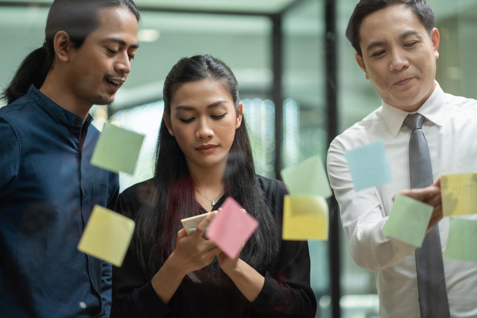 Free Stock Photo of Business team meeting, using post it notes ...