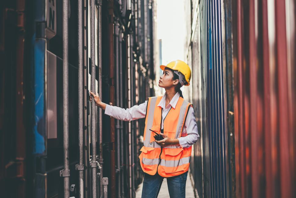Free Stock Photo of Female worker checking container lock at warehouse ...