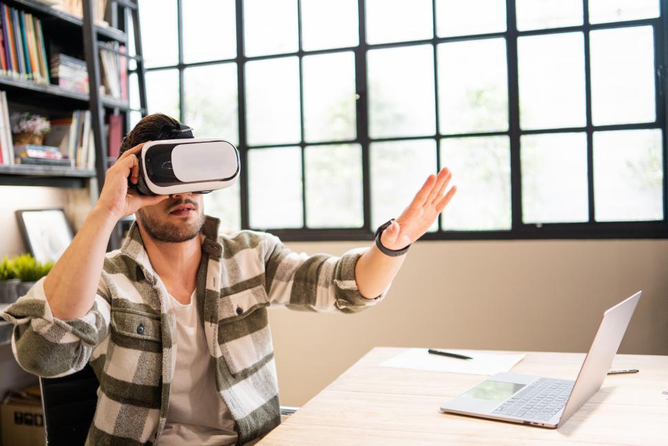 Free Stock Photo of Young product designer wearing VR glasses ...