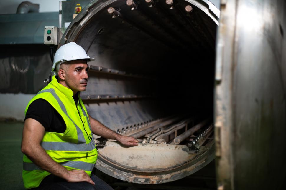 Free Stock Photo of Worker repairing industrial machine in factory ...