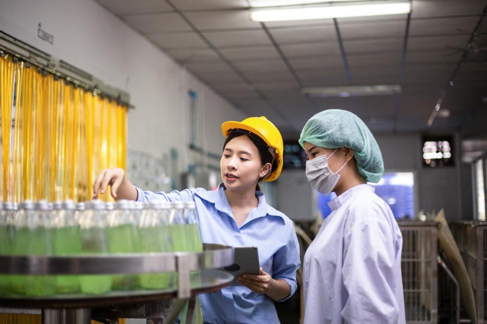 Free Stock Photo of Female workers checking quality control for drink ...