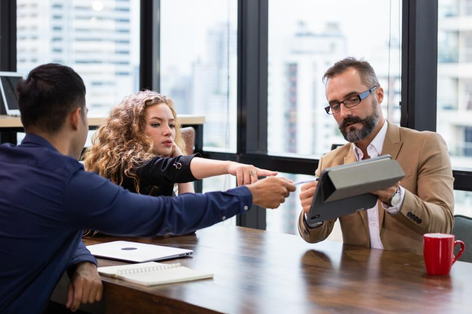 Free Stock Photo of Businessman presenting project on digital tablet ...