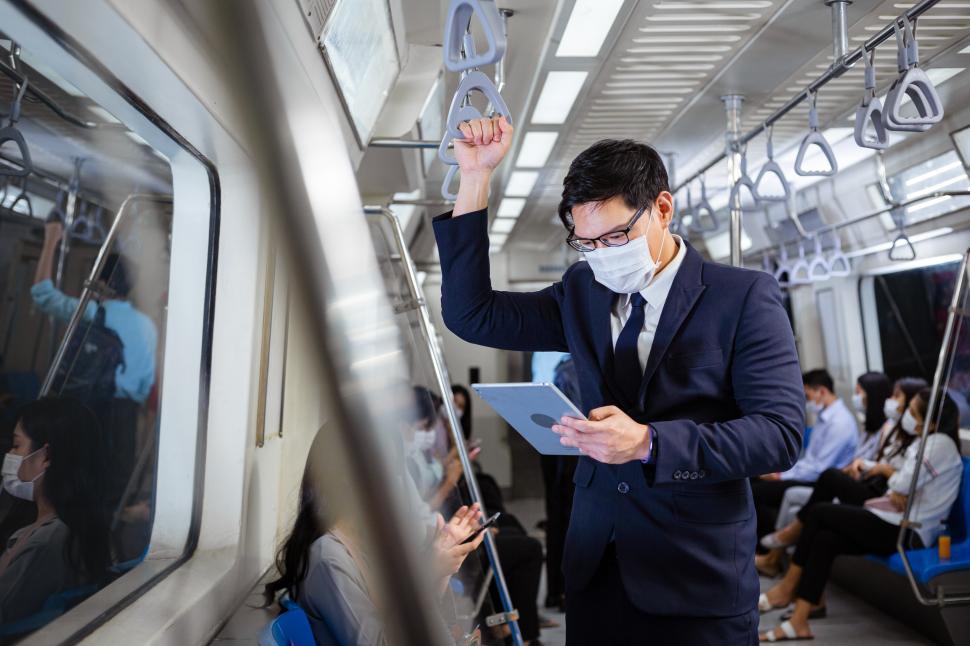 Free Stock Photo of Businessman wearing mask using digital tablet on a ...