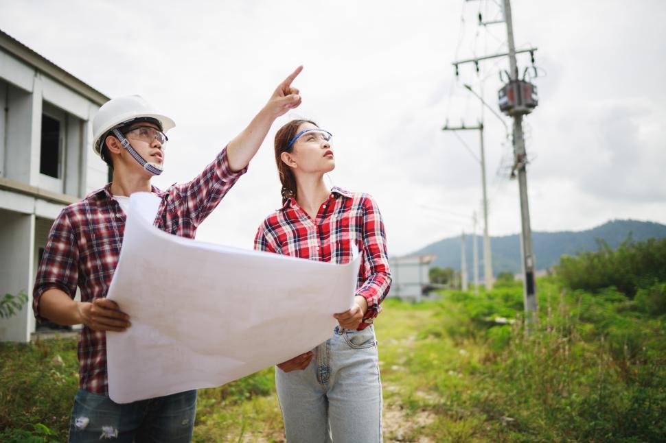 Free Stock Photo of Two Civil Engineers or field engineers planning at ...