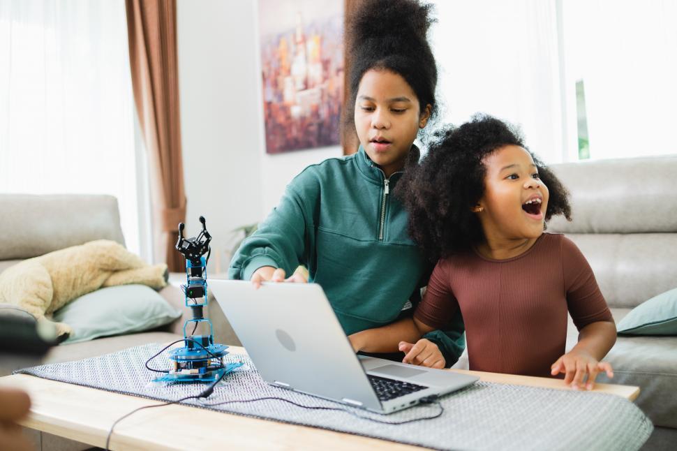 Free Stock Photo of Girls are excited about learning robotic technology ...