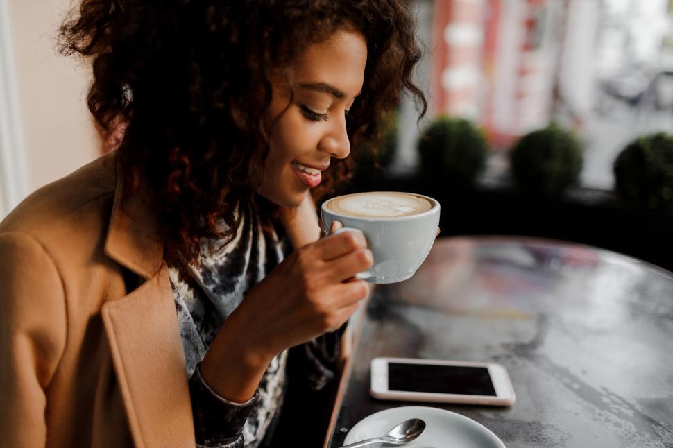 Free Stock Photo of Woman checking her news feed or messaging via ...